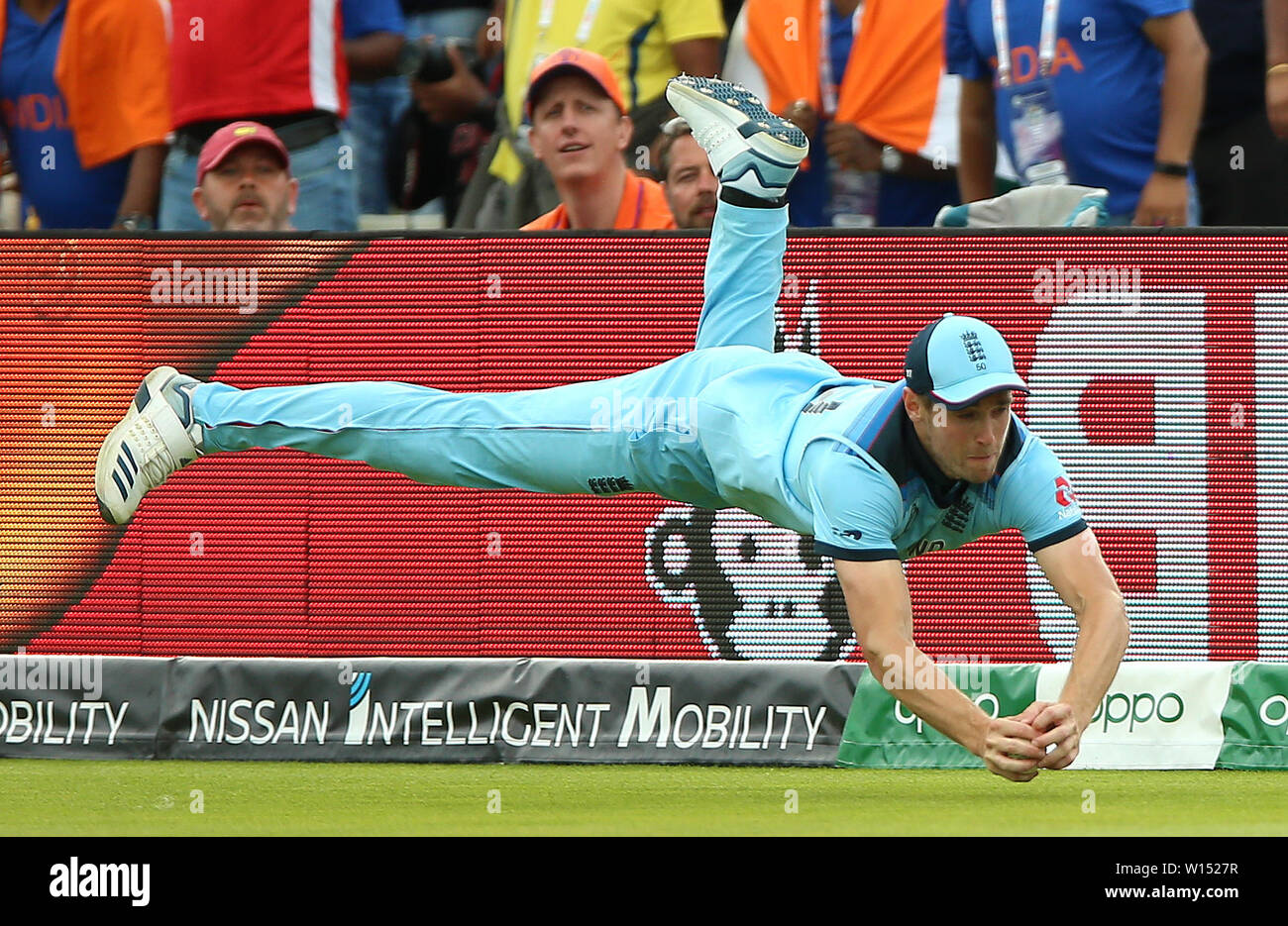 England's Chris Woakes takes a diving catch during the ICC Cricket World Cup group stage match ...