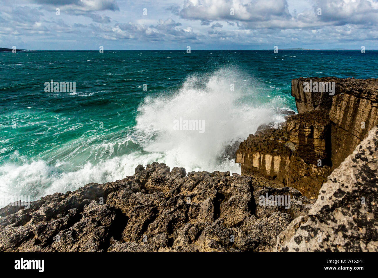 View of the waves crash on the rocks of limestone coastal cliff in ...