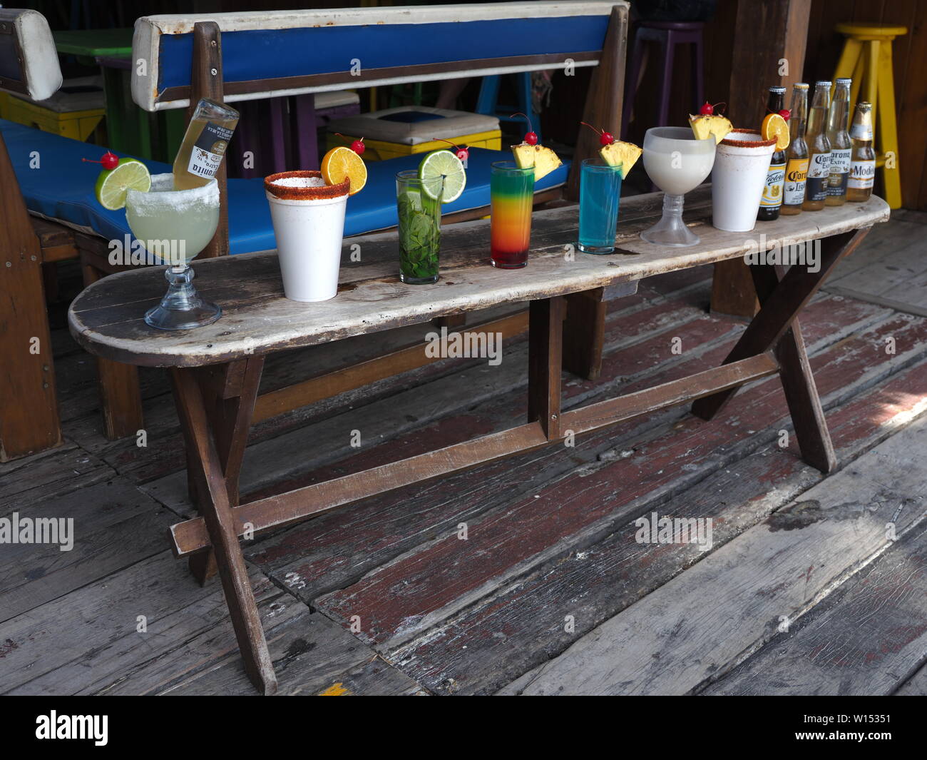 Wooden bench with drinks on playa tortugas at Caribbean Sea in Cancun ...