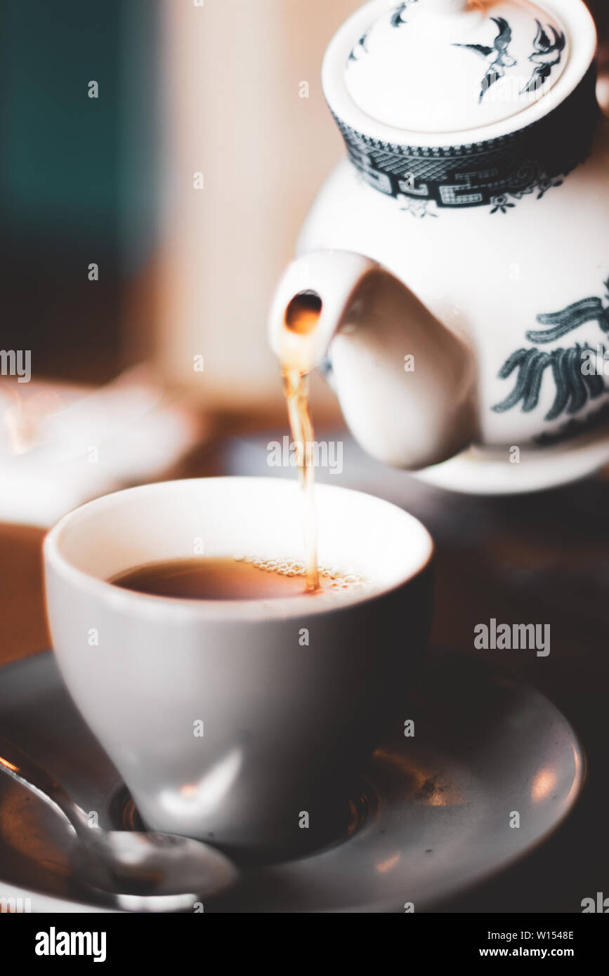 Tea pot pouring tea cup hi-res stock photography and images - Alamy