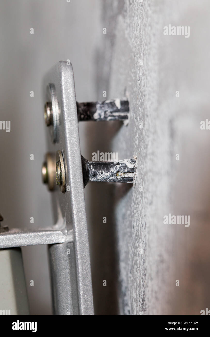 weak plastic dowels come out from wall and monitor or tv moun Stock ...