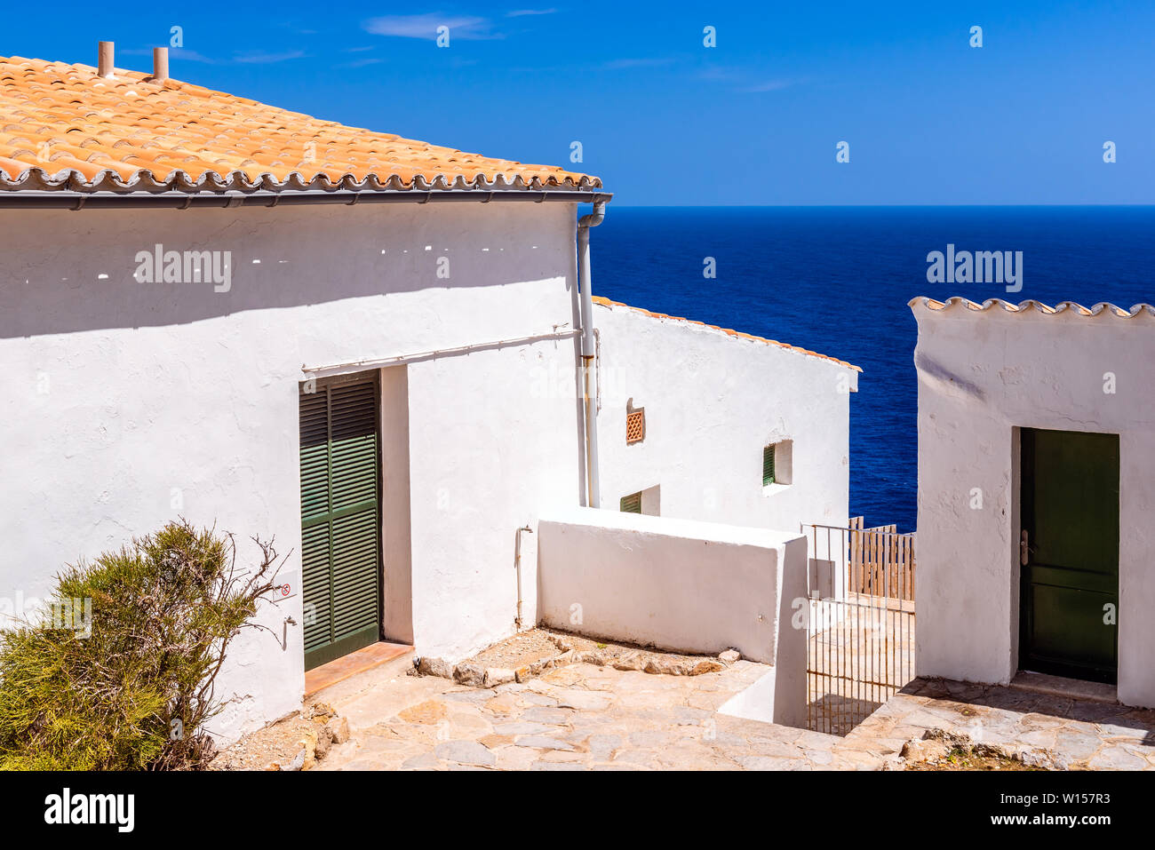 Traditional Spanish architecture, a house with a view of the blue sea ...