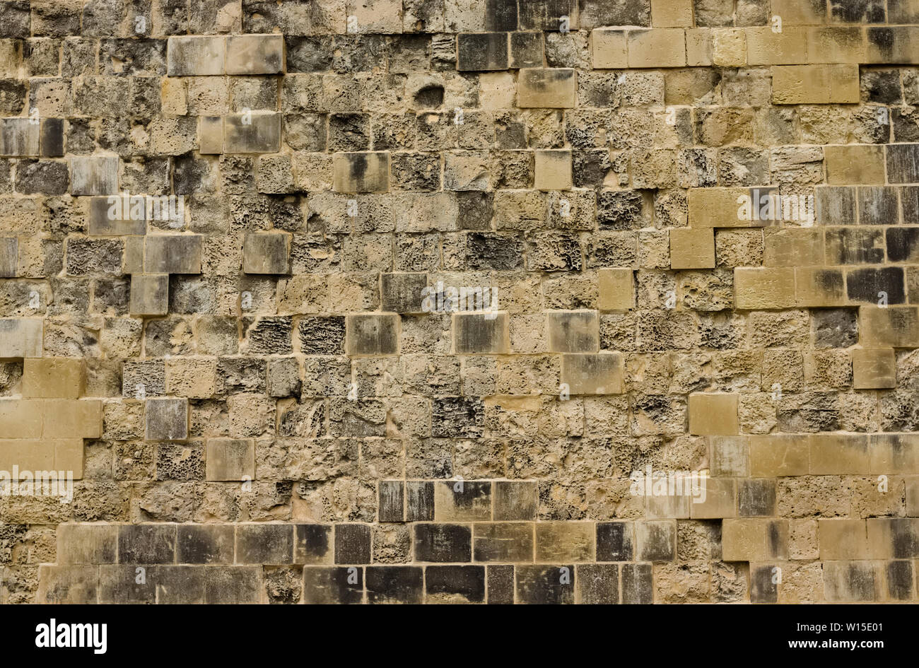 Old and weathered beige limestone brick wall Stock Photo - Alamy