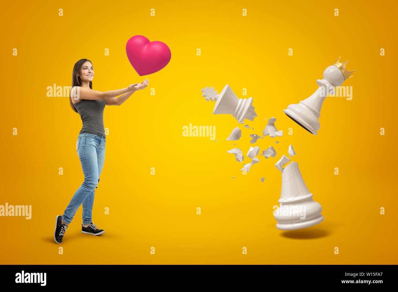 Young smiling girl in casual clothes holding big red heart, standing ...