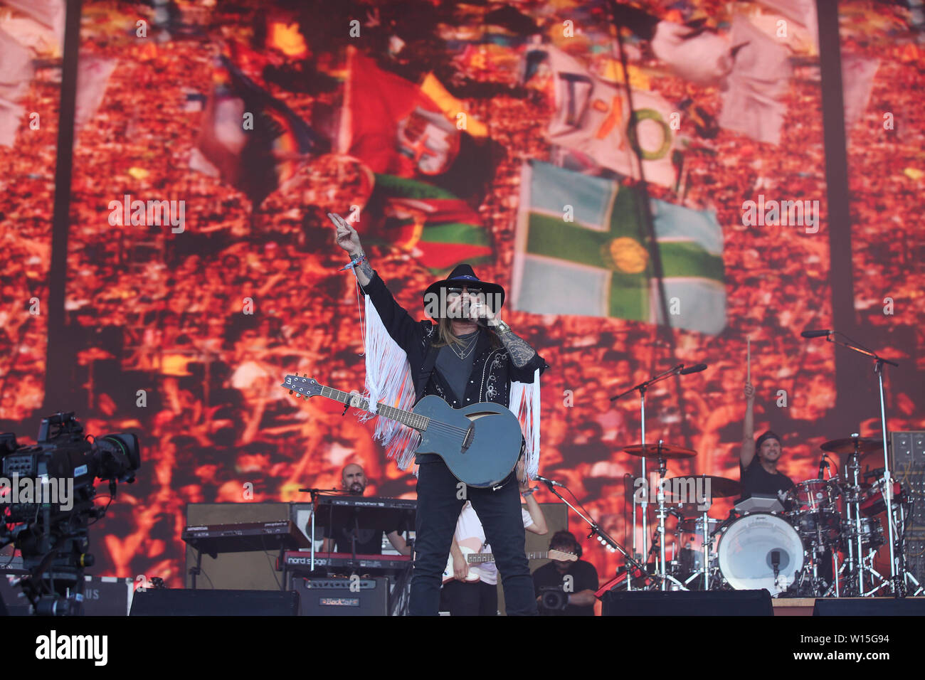 Billy Ray Cyrus performing with Miley Cyrus (not pictured) on the ...