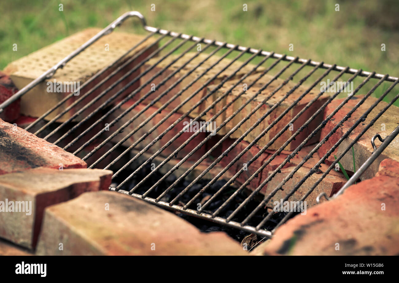 Grill grid outdoor in a garden Stock Photo - Alamy
