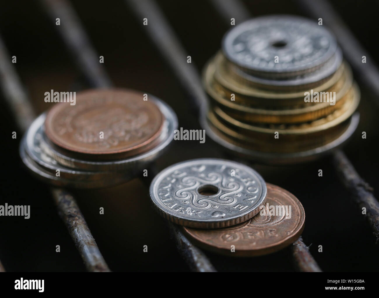 Coins on grill grid outdoor in a garden Stock Photo - Alamy