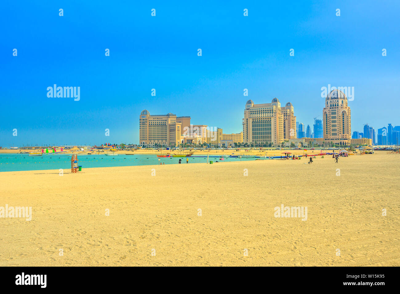 Doha, Qatar - February 22, 2019: gold sand of Katara Beach with the St ...