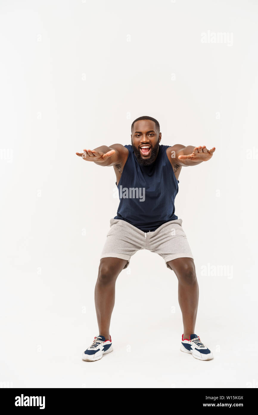 African sport man exercising and stretching on white background Stock ...