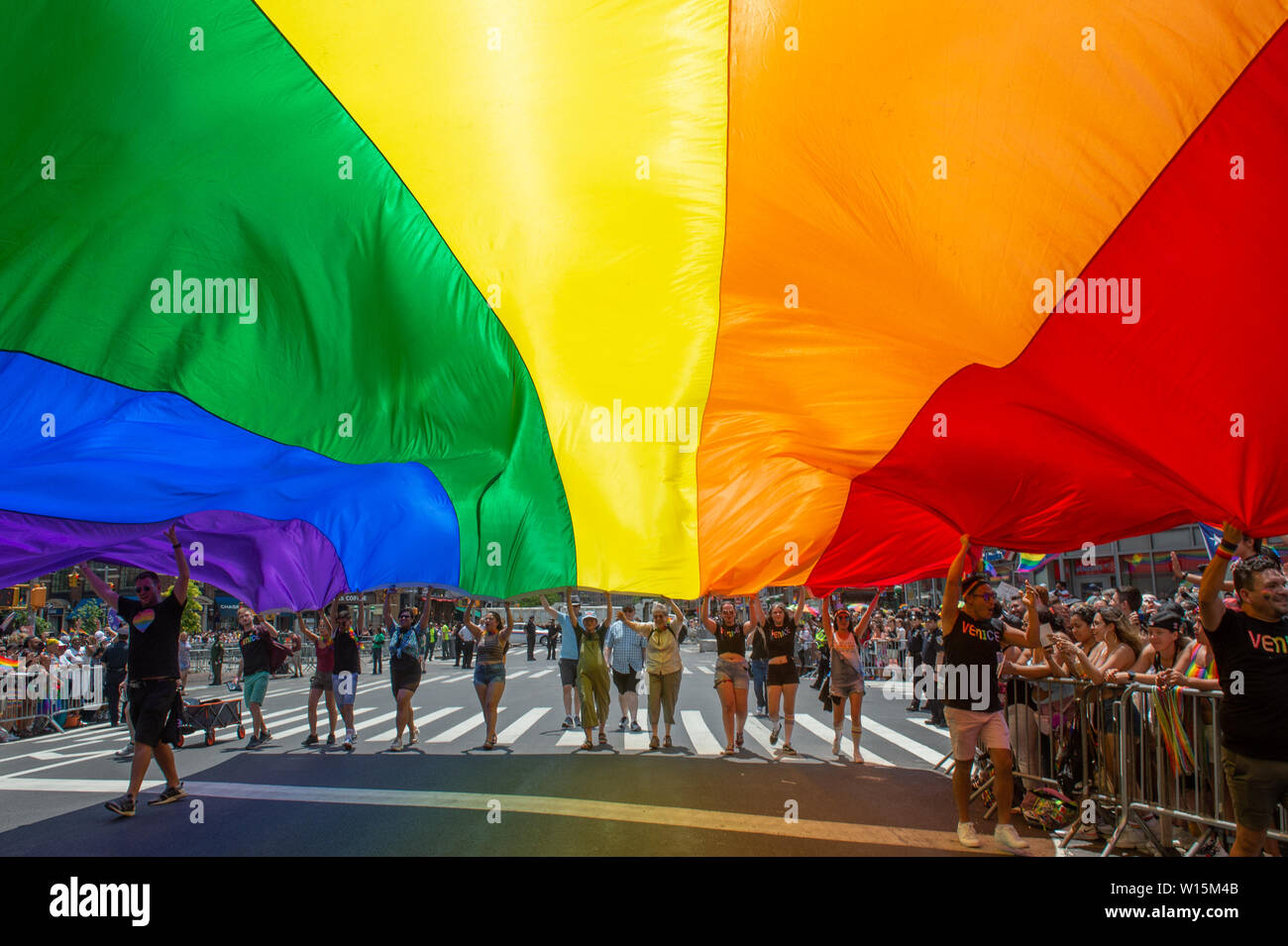 New York, NY, USA. 30th June 2019. The rainbow flag is carried during ...