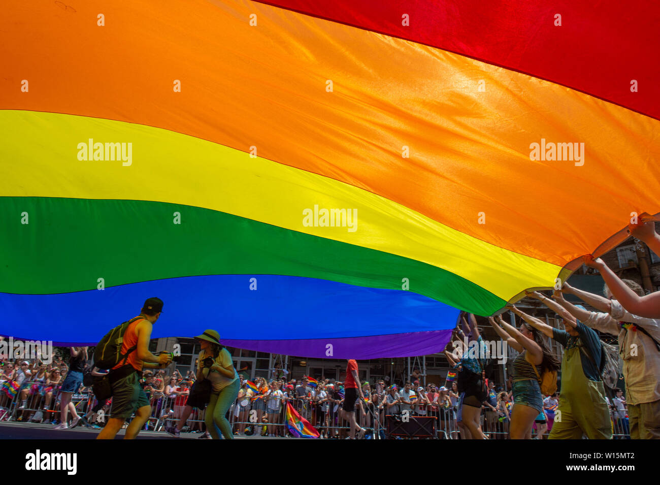 New York, NY, USA. 30th Jun 2019. The rainbow flag is carried at the ...