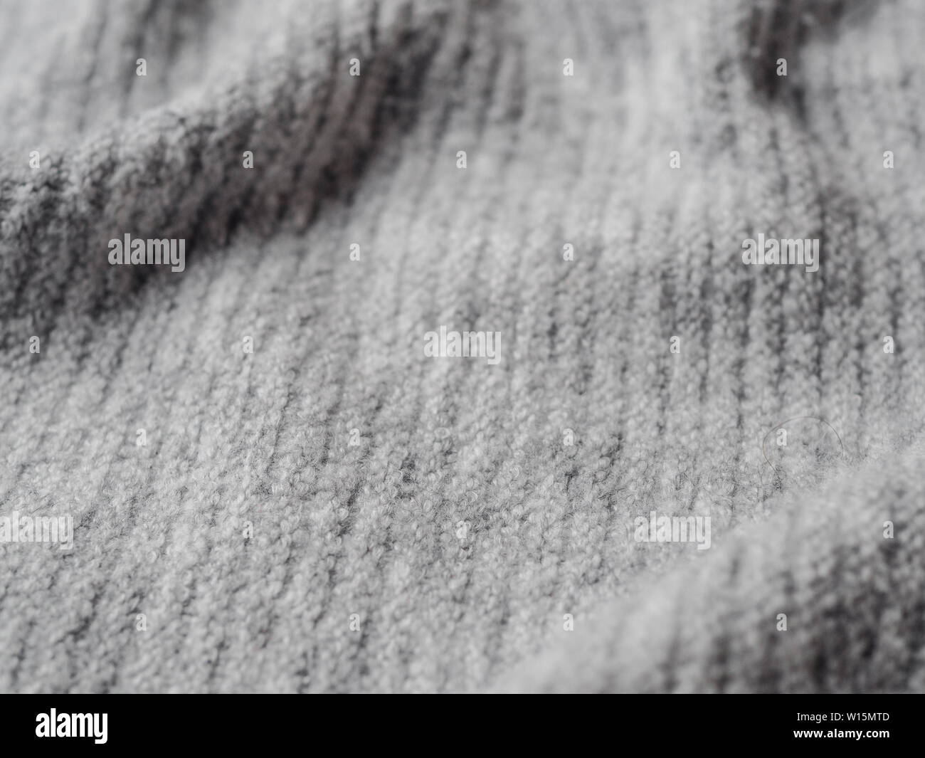 Gray sweater fabric texture. Clothes sweater background with folds ...