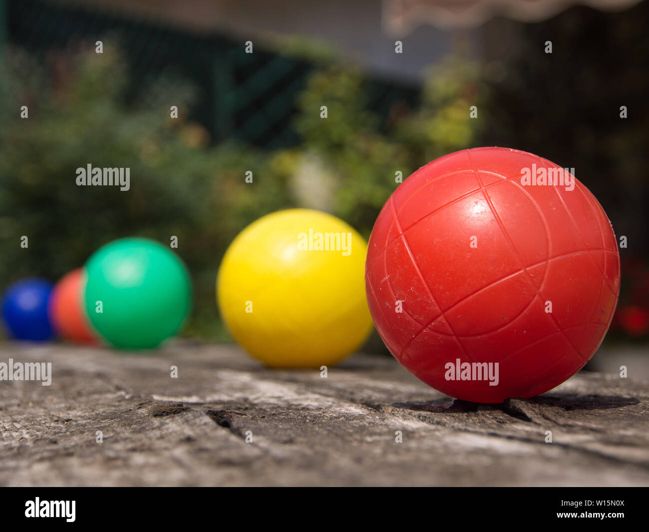 colored plastic balls in a row Stock Photo - Alamy