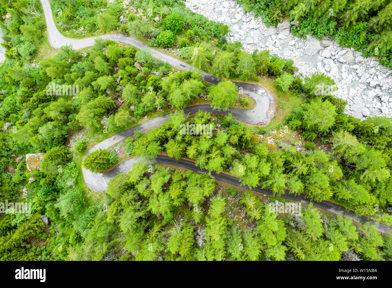 Amazing aerial view of windy road in a mountain valley, Switzerland ...