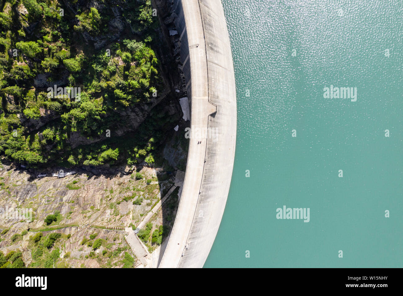 Water reservoir Lac de Emosson, vertical drone shot of the dam wall ...