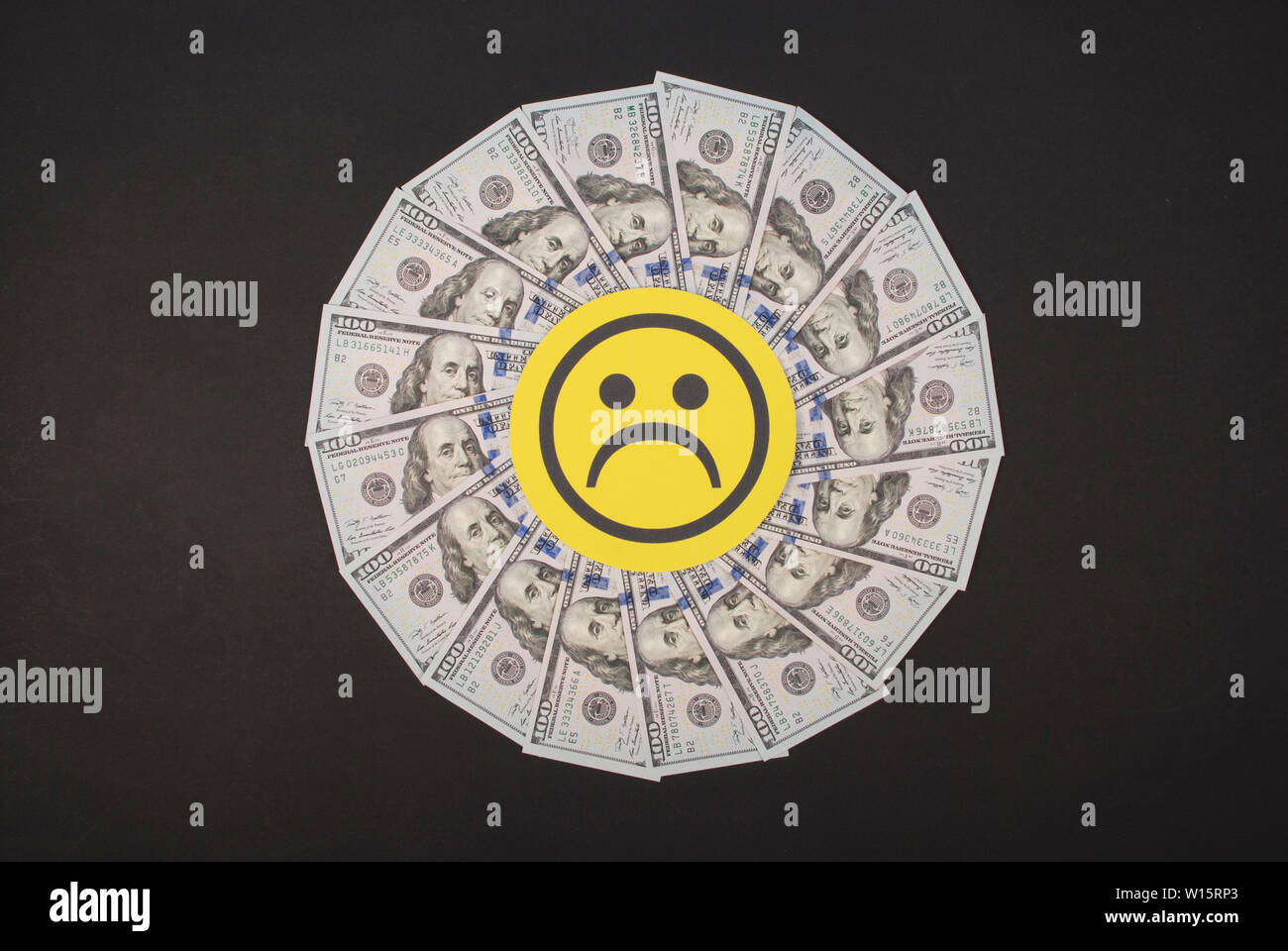 Sad smile faces on mandala kaleidoscope from money. Abstract money ...