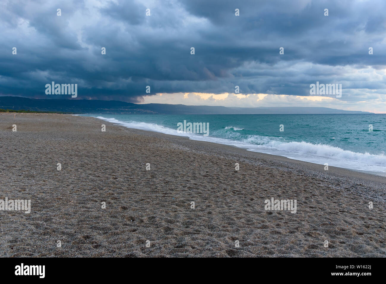 Dark clouds over beach hi-res stock photography and images - Alamy