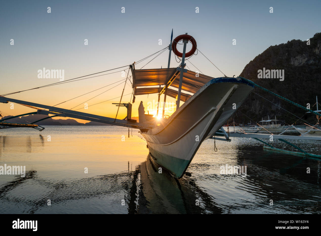 Tropical harbor bay in evening. Golden hour in lagoon in Philippines ...