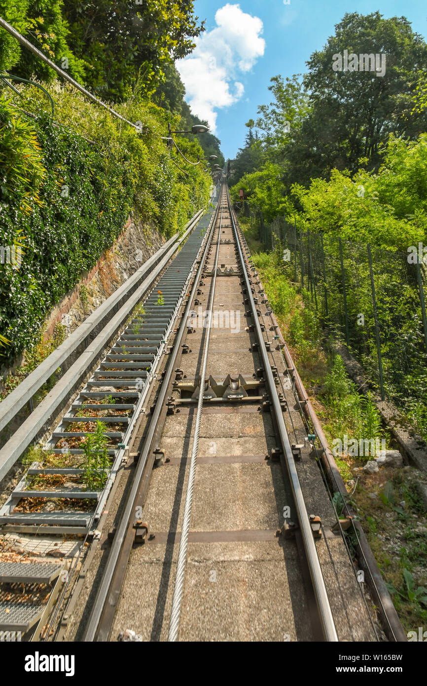 COMO, ITALY - JUNE 2019: Track on the funicular railway in Como which ...