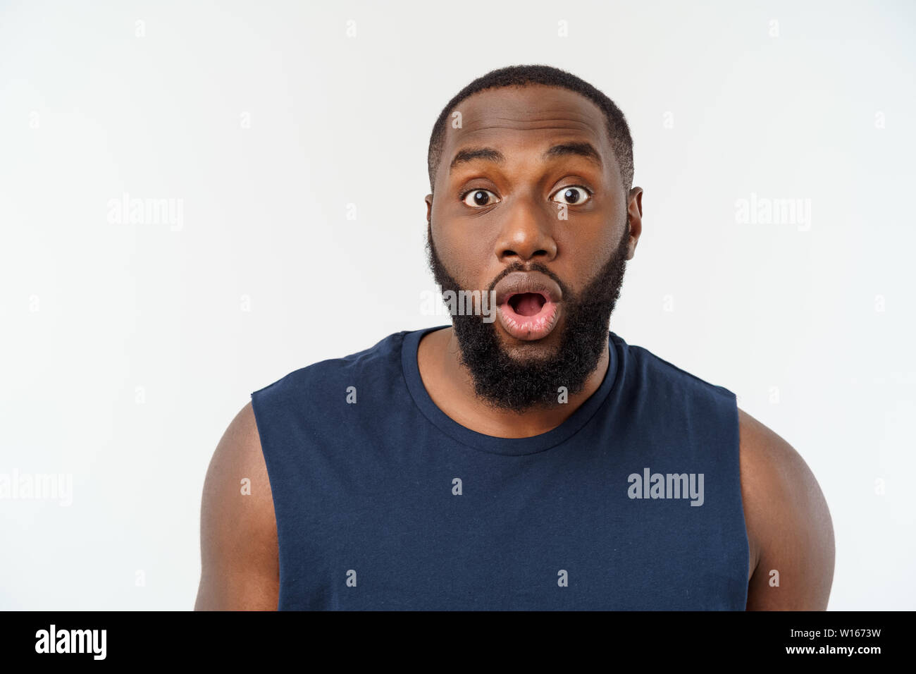 Young fitness african black man in sport wear cheering carefree and ...