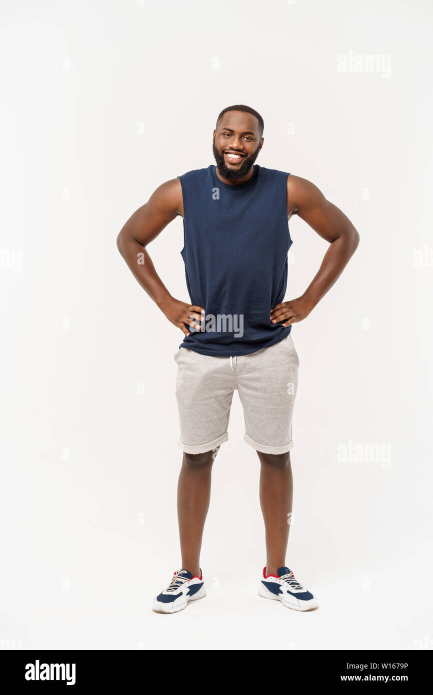 Young fitness african black man in sport wear cheering carefree and ...