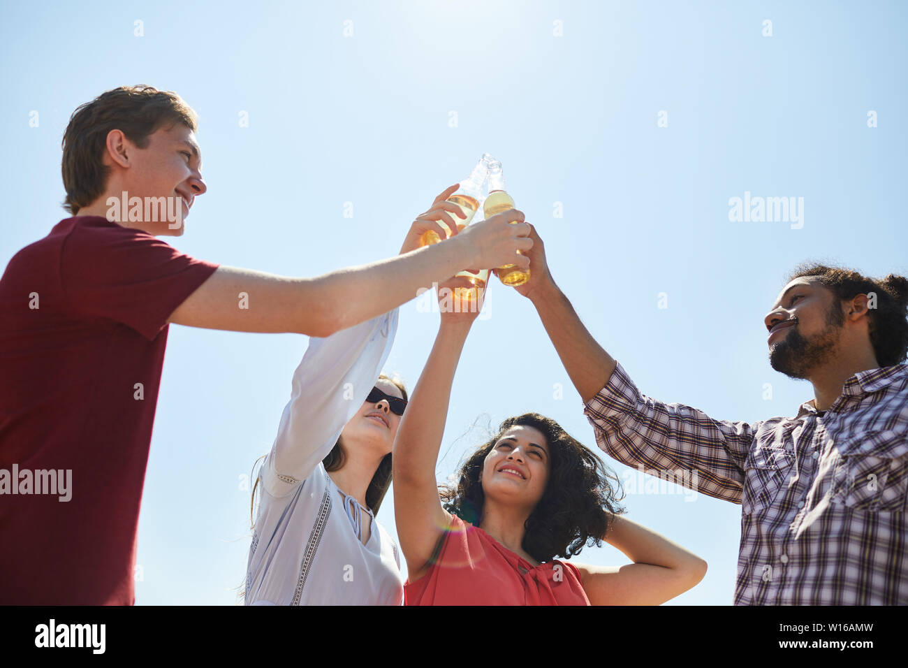 Couple clinking bottles hi-res stock photography and images - Alamy
