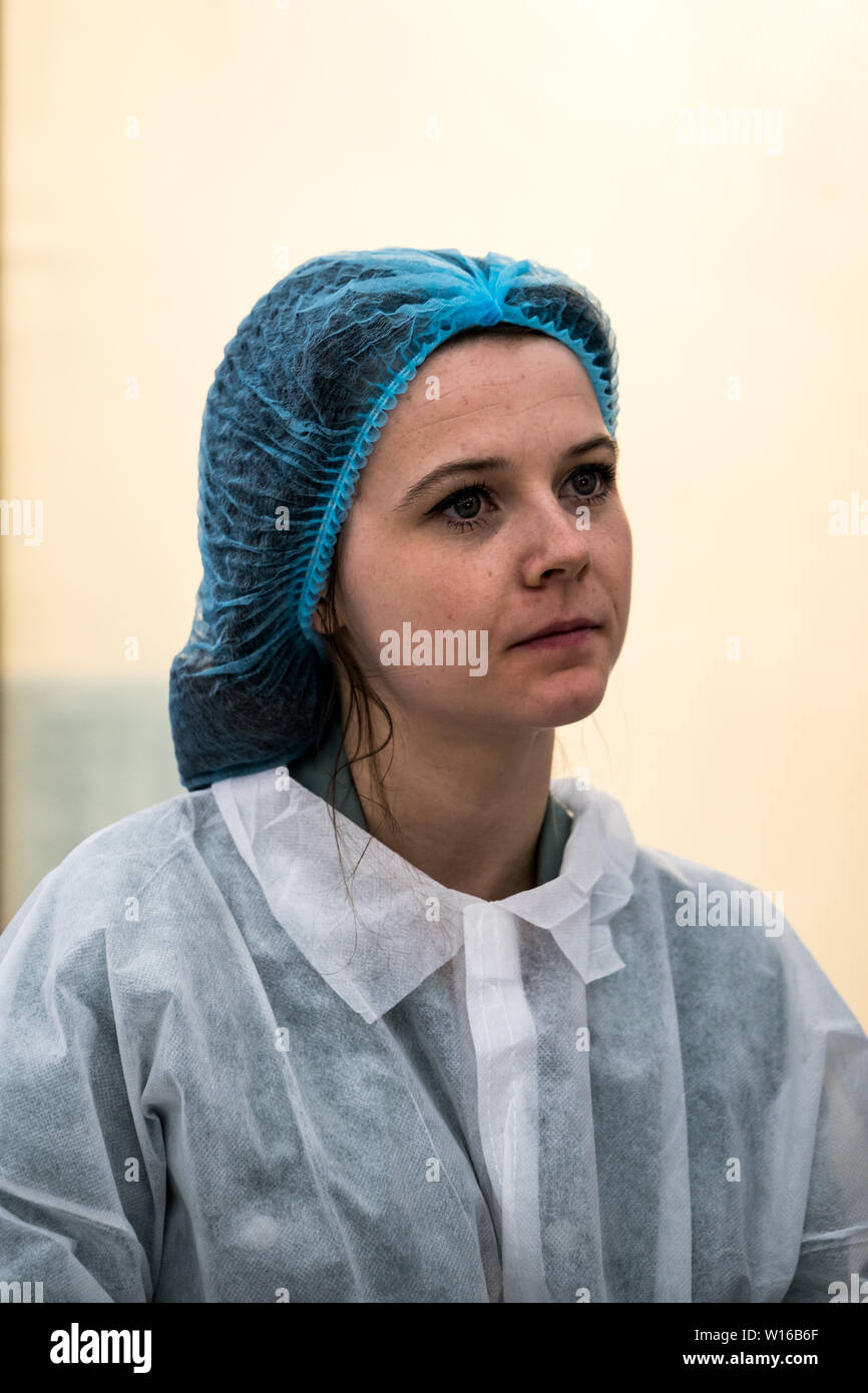 A young lady wearing protective clothing visiting Quicke's cheese ...