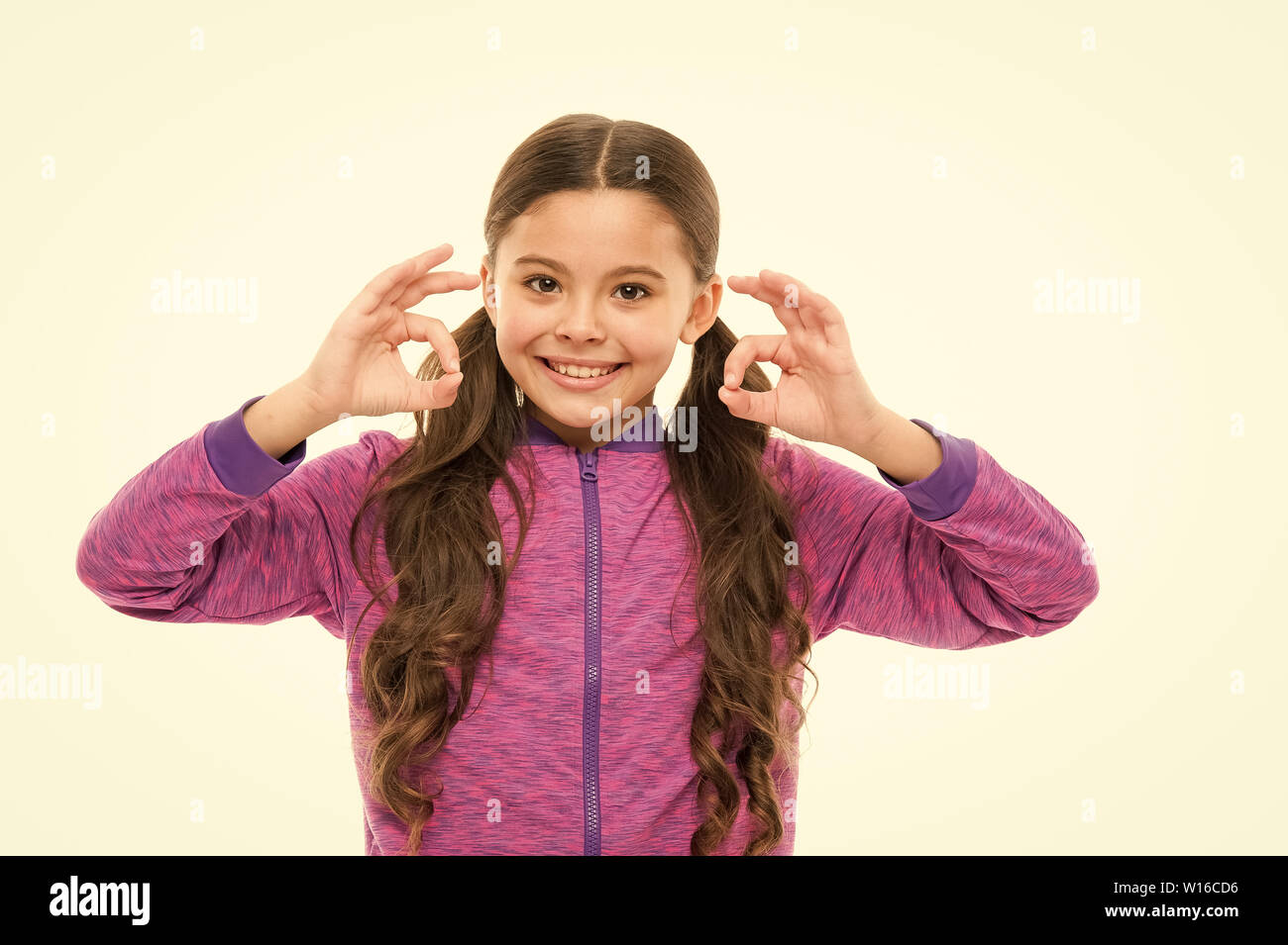 Things gonna be alright. Girl child happy face while show ok gesture ...