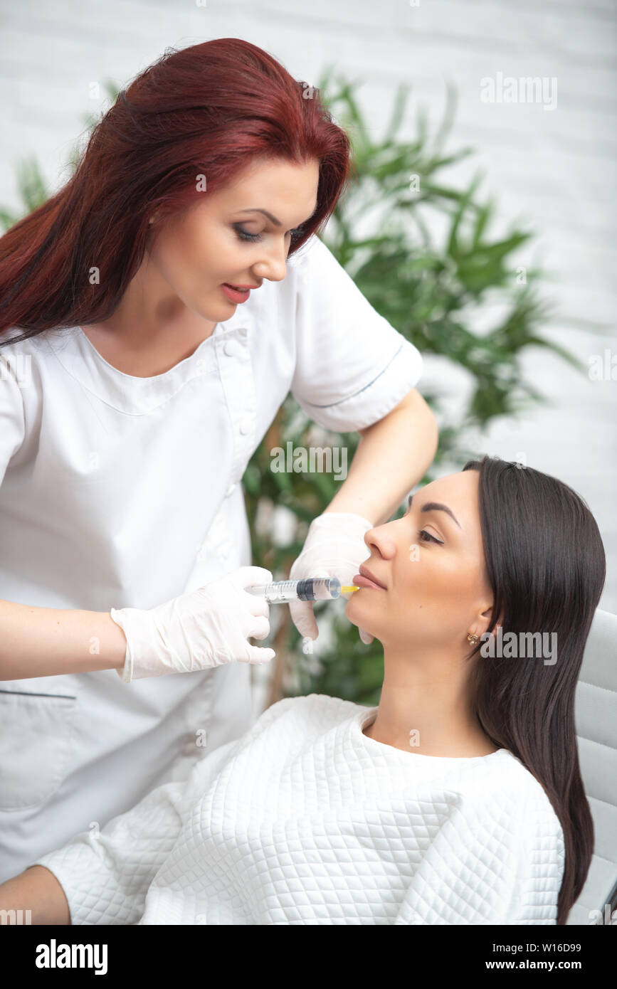 Filler injection for face. Plastic aesthetic facial surgery. Doctor ...