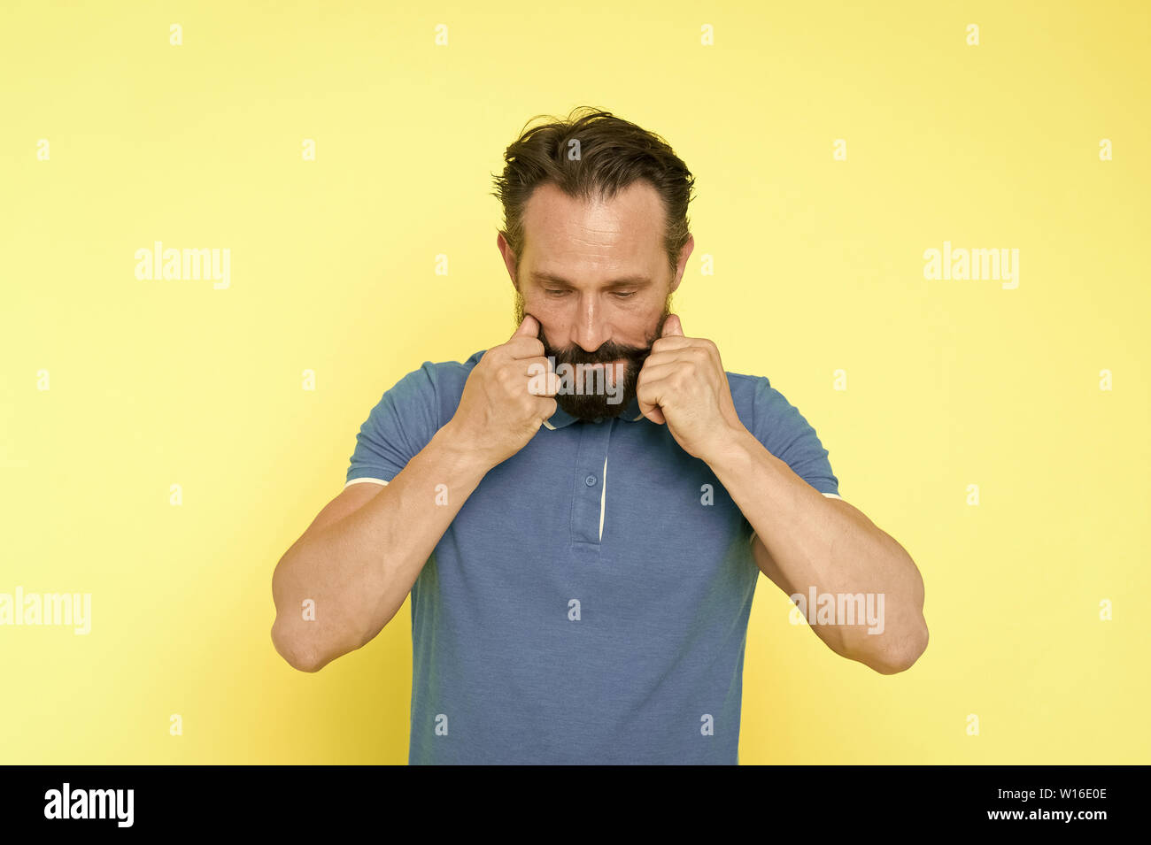 Man bearded twisting moustache yellow background. Ultimate moustache ...