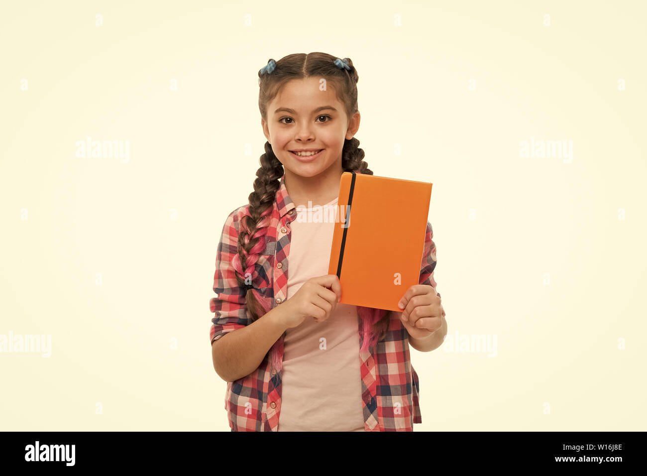 Child cute girl hold notepad or diary isolated on white background ...
