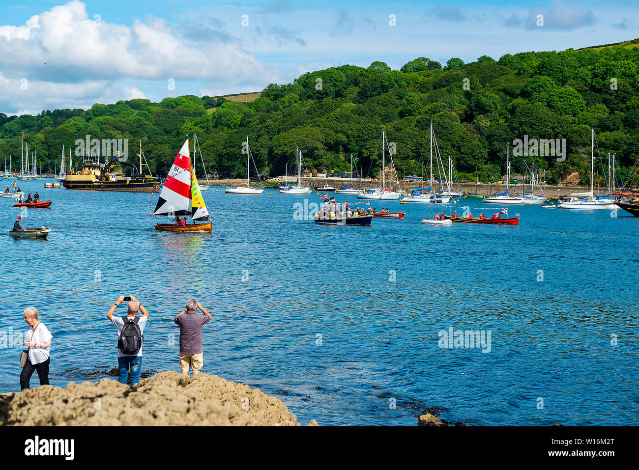 A flotilla of boats paraded along the estuary at Fowey in remembrance ...