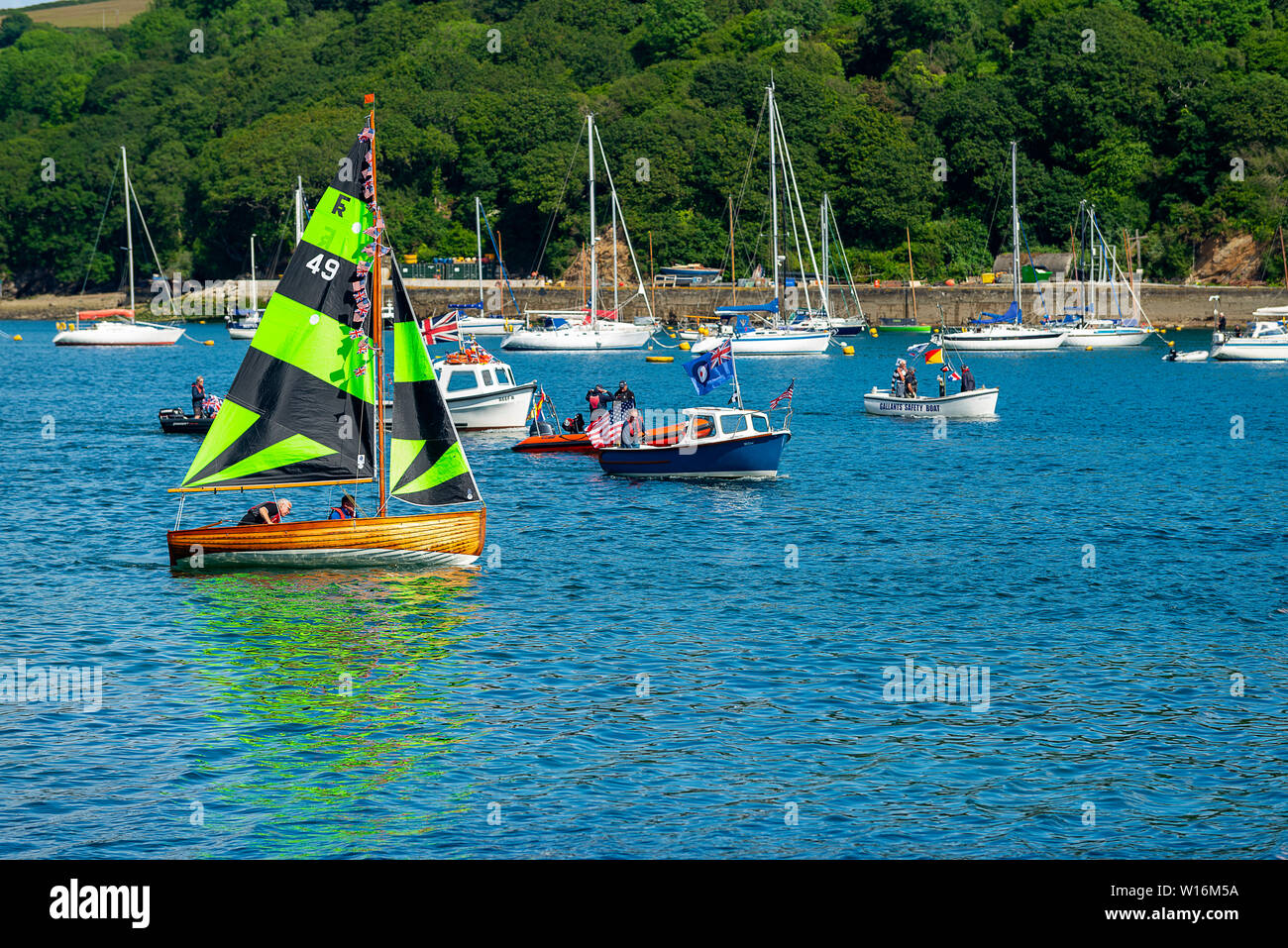 A flotilla of boats paraded along the estuary at Fowey in remembrance ...