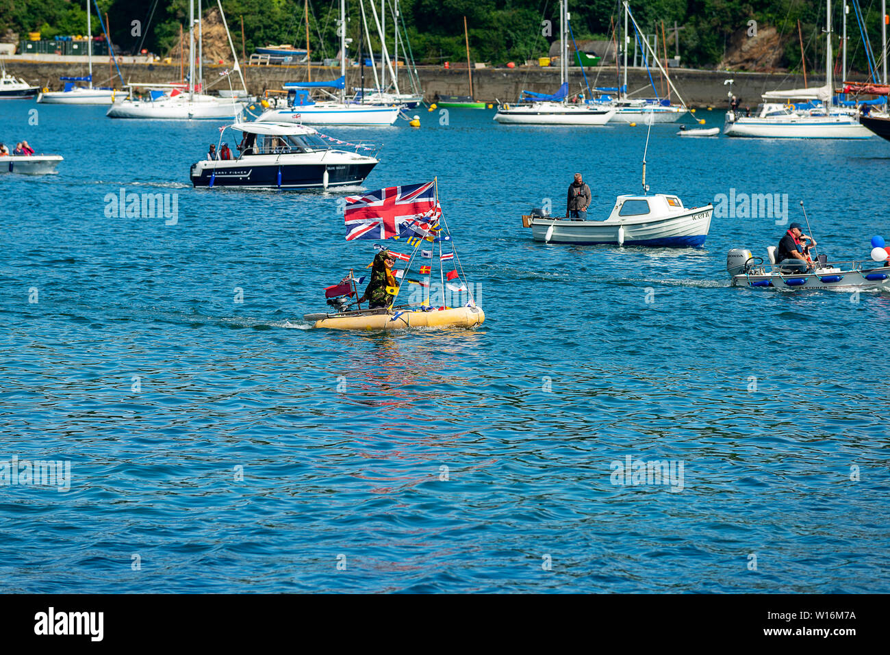 A flotilla of boats paraded along the estuary at Fowey in remembrance ...