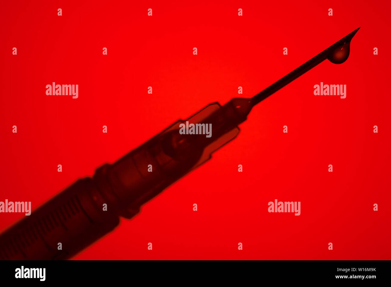 Syringe filled with blood and dripping from the needle silhouette Stock ...