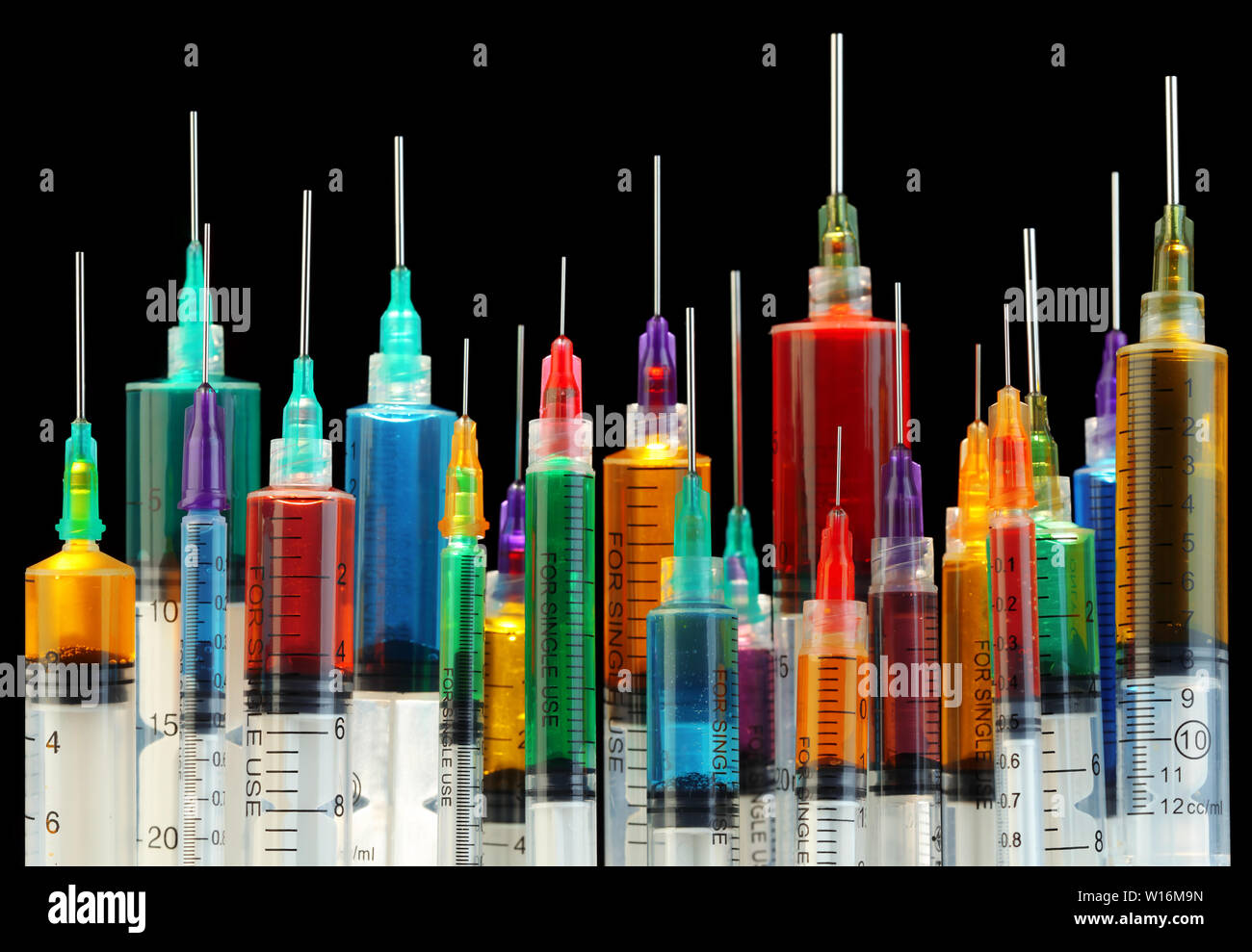 Collection of bright and colorful syringes Stock Photo - Alamy