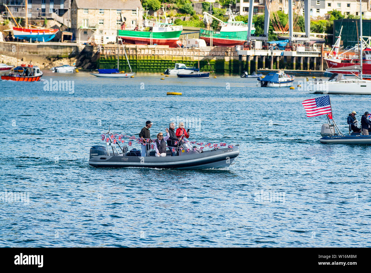 A flotilla of boats paraded along the estuary at Fowey in remembrance ...