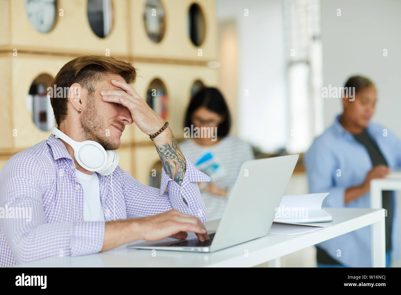 Confused businessman in front of computer hi-res stock photography and ...