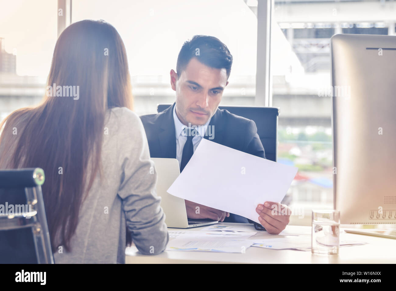 Managers reviewing reports hi-res stock photography and images - Alamy