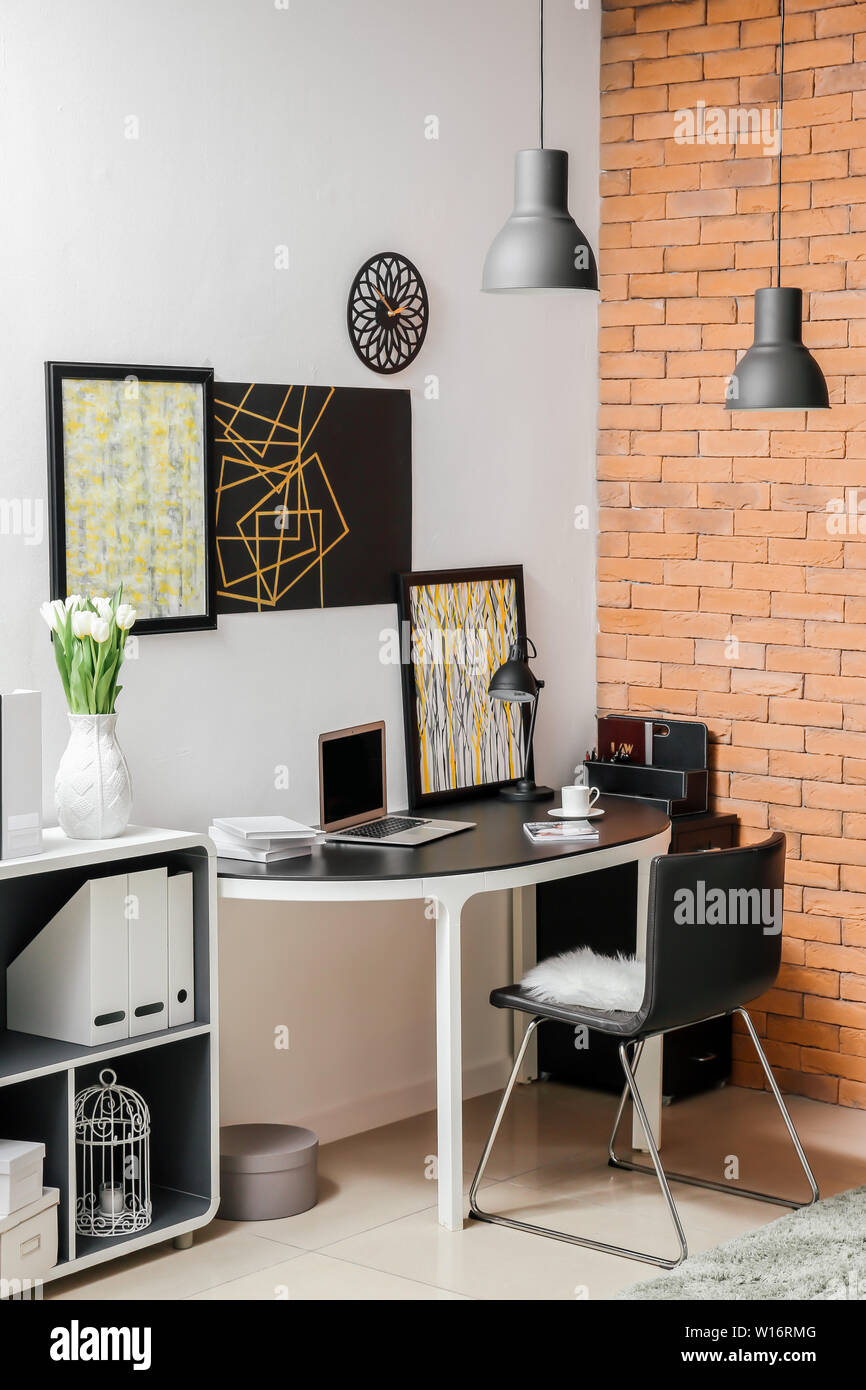 Stylish modern workplace in room Stock Photo - Alamy