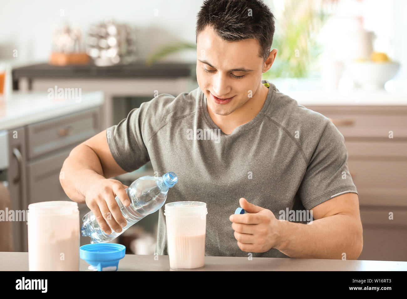 Powder pouring into bottle of water hi-res stock photography and images ...