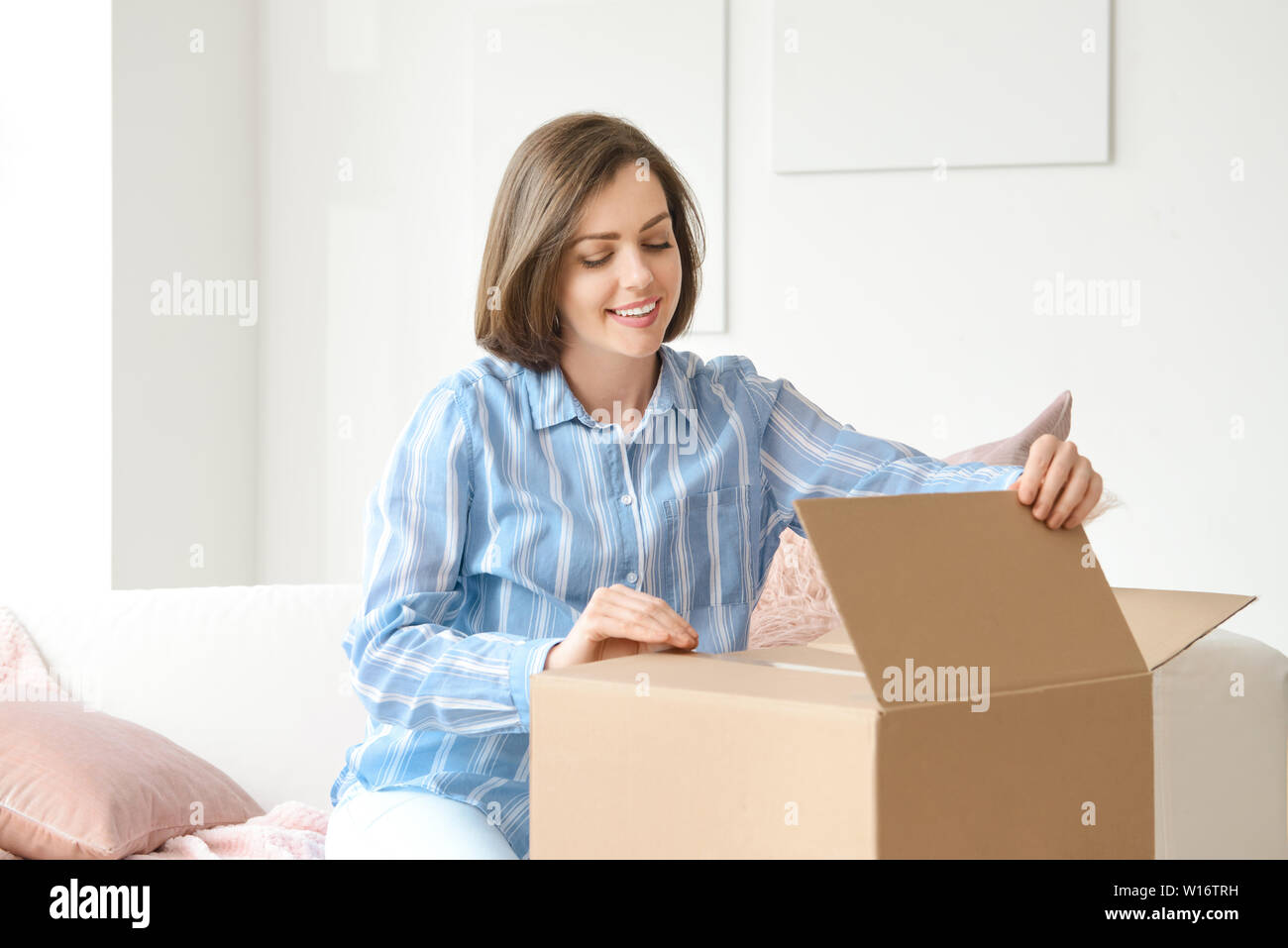Opening parcel hi-res stock photography and images - Alamy