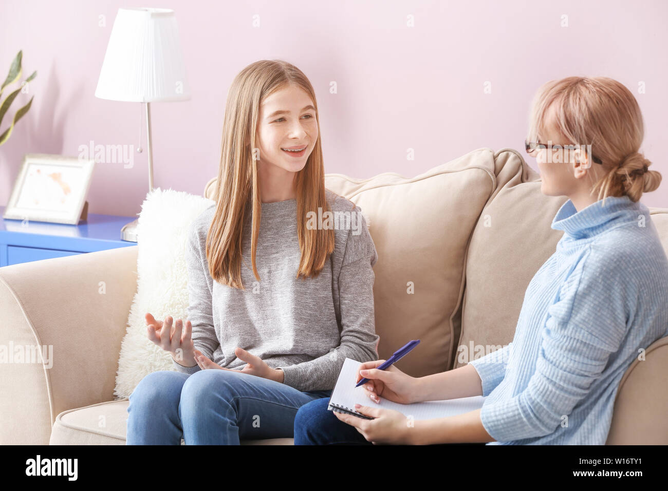 Female psychologist working with teenage girl in office Stock Photo - Alamy