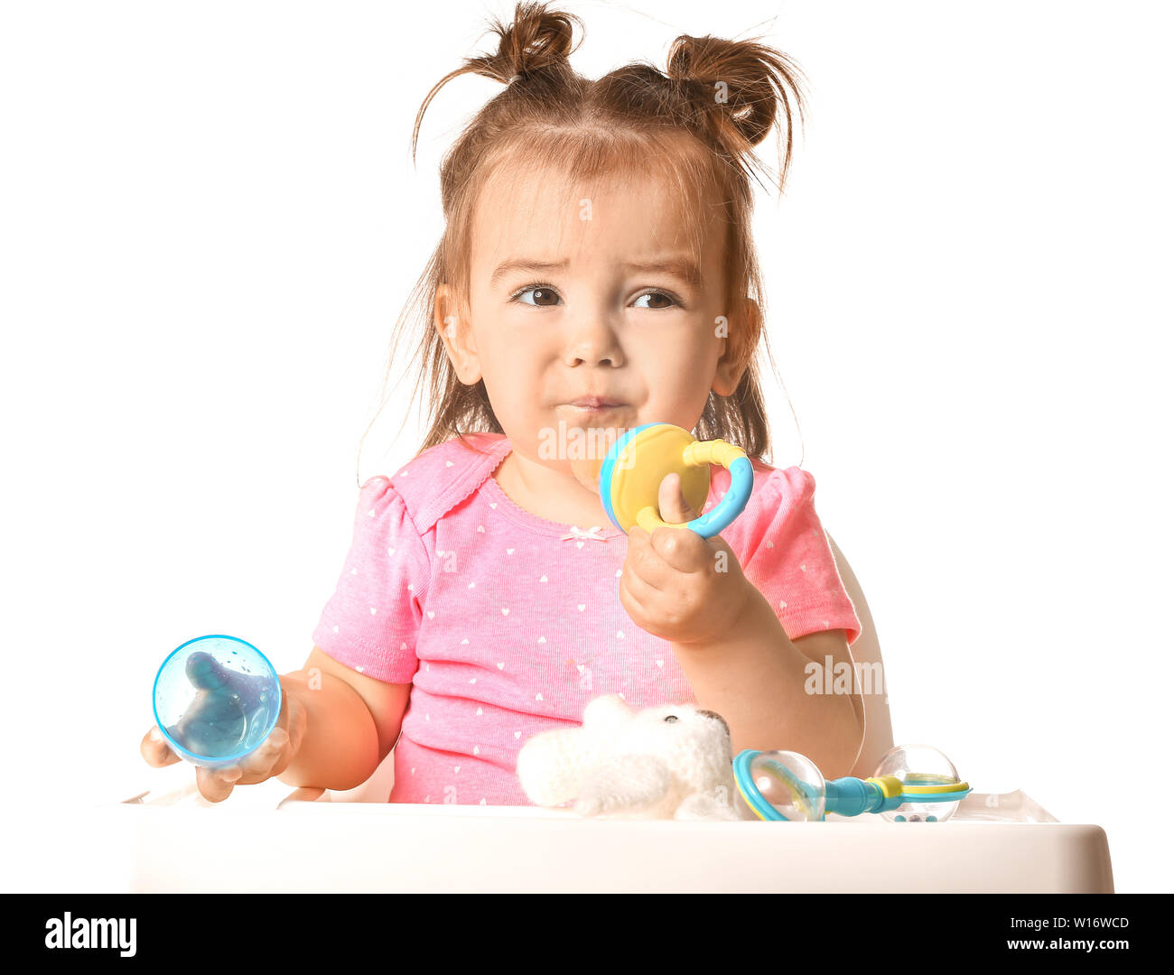 Cute little girl with nibbler on white background Stock Photo - Alamy
