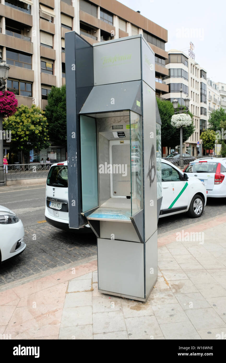 Pay phone booth without a telephone; removed for lack of business ...