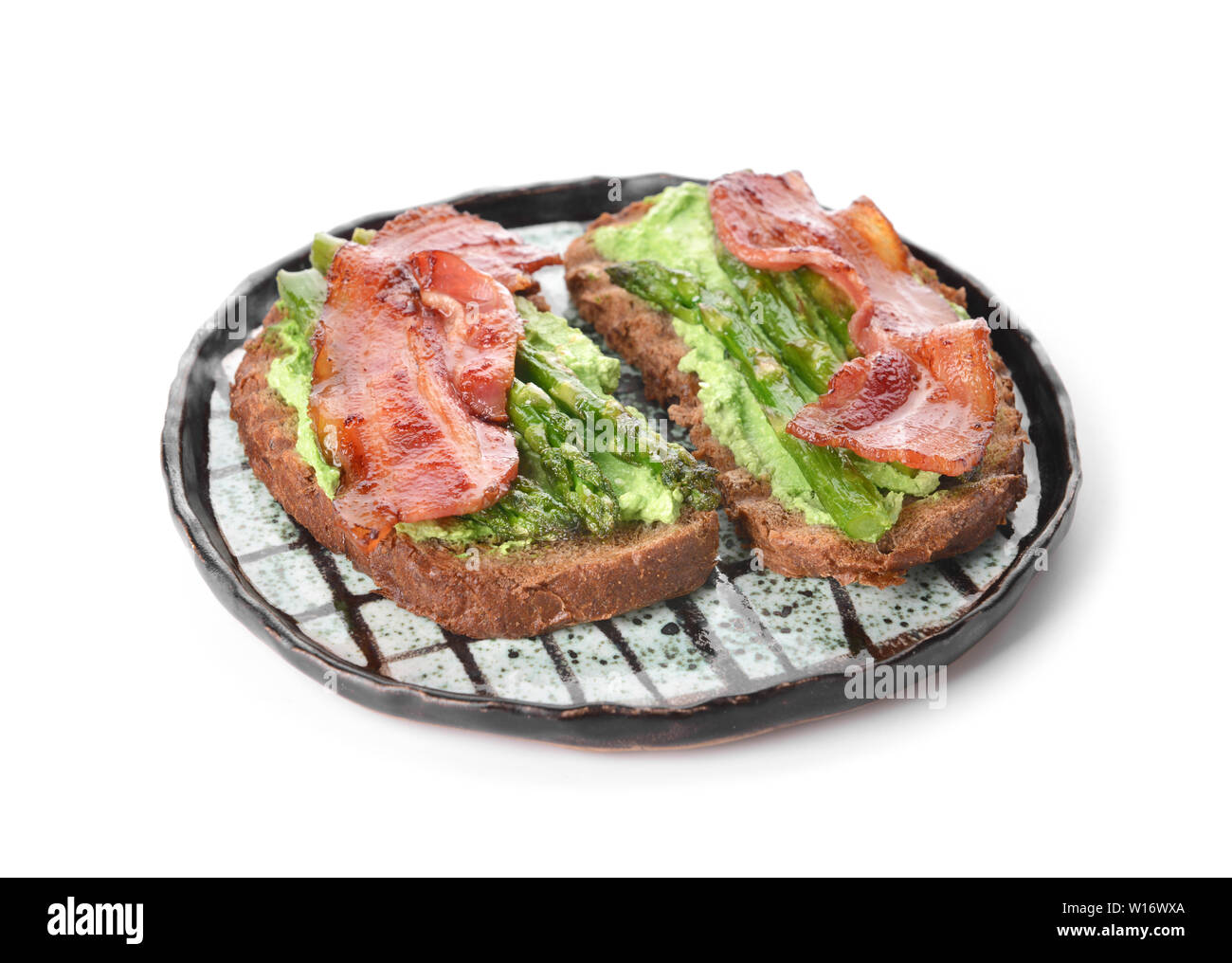 Plate with tasty toasts on white background Stock Photo - Alamy