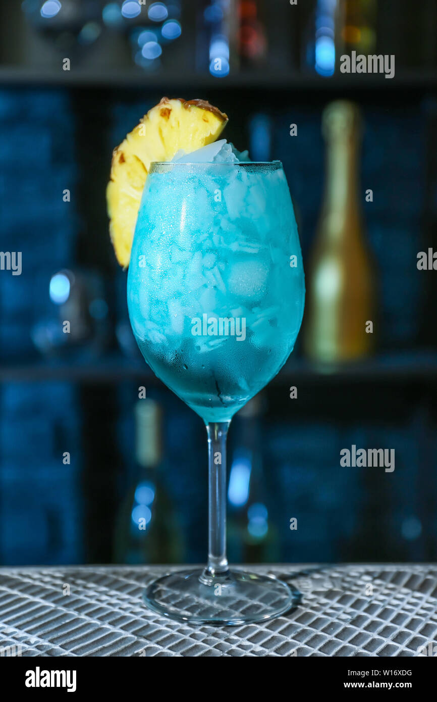 Glass of Blue Lagoon cocktail on table in bar Stock Photo - Alamy