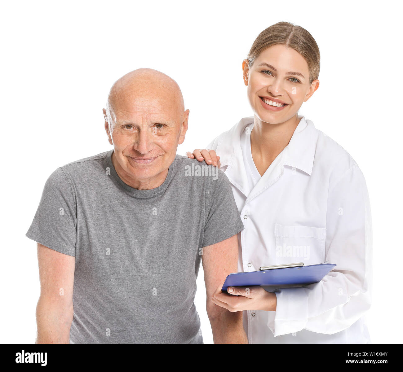 Elderly man with doctor on white background Stock Photo - Alamy