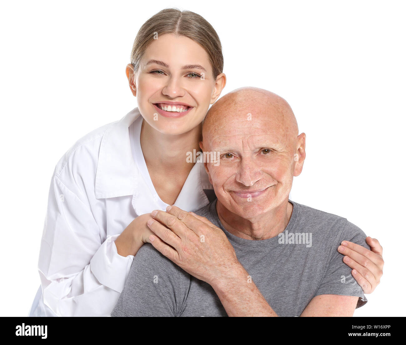 Elderly man with doctor on white background Stock Photo - Alamy