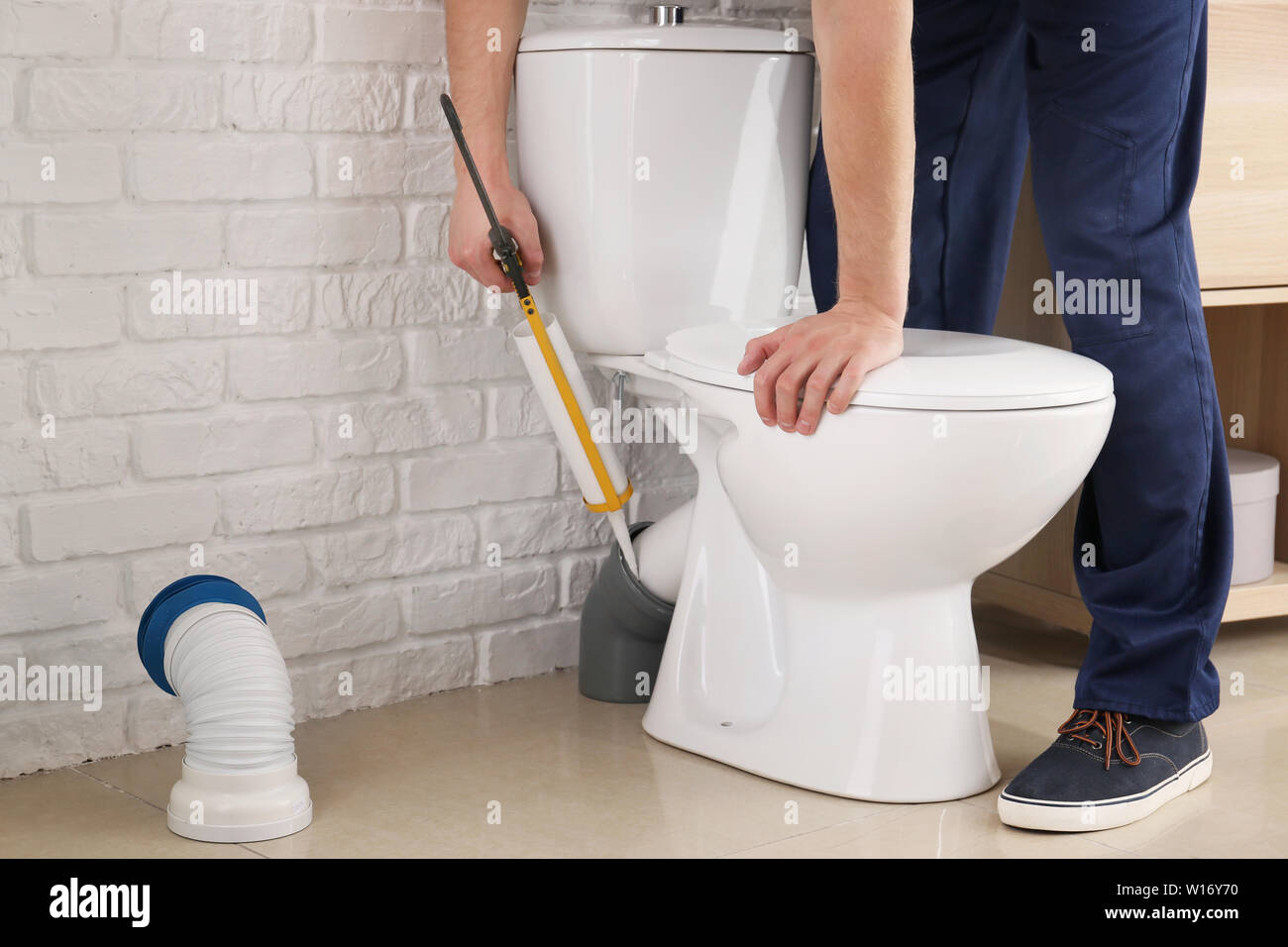 Professional plumber working toilet hi-res stock photography and images ...